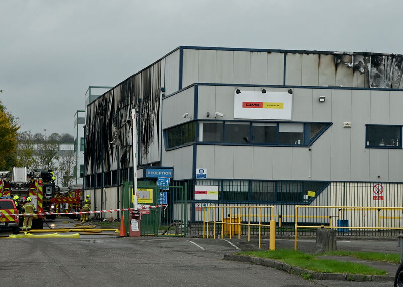 Fire crews continue to dampen hot spots following fire at commercial ...