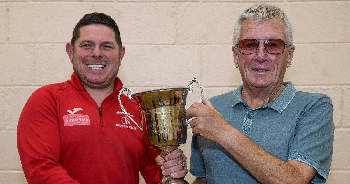 Mayfield Boxing Club are presented with the Victor Aston Cup following ...